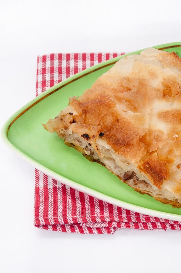 Turkish Burek with Meat on a Green Plate with Fork and Knife Stock ...