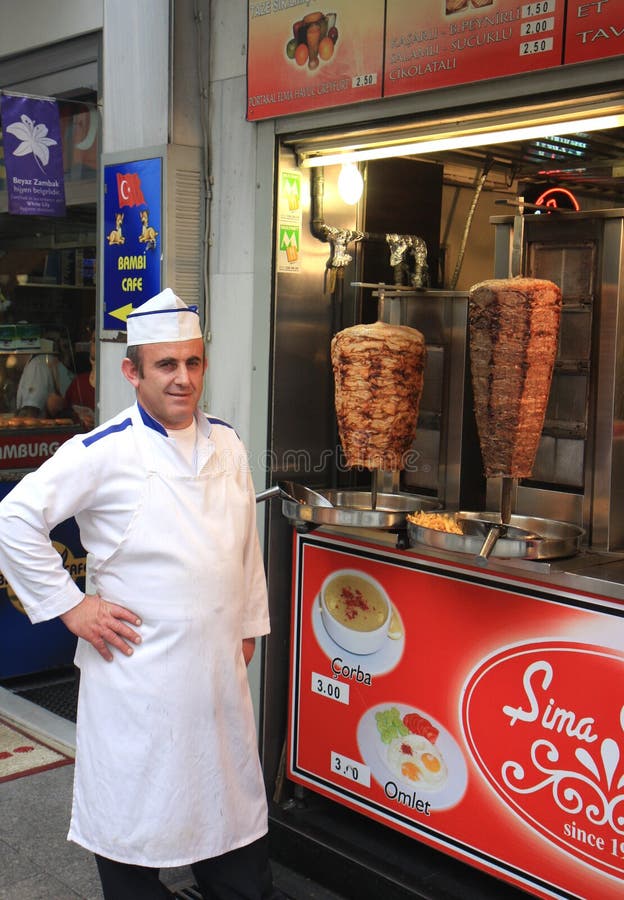 Turkish Chef Slices Doner Meat from a Rotating Skewer at a Kebab Shop ...