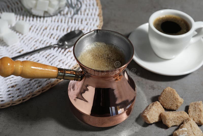 Turkish Coffee. Cezve and Cup with Hot Aromatic Coffee and Sugar on ...