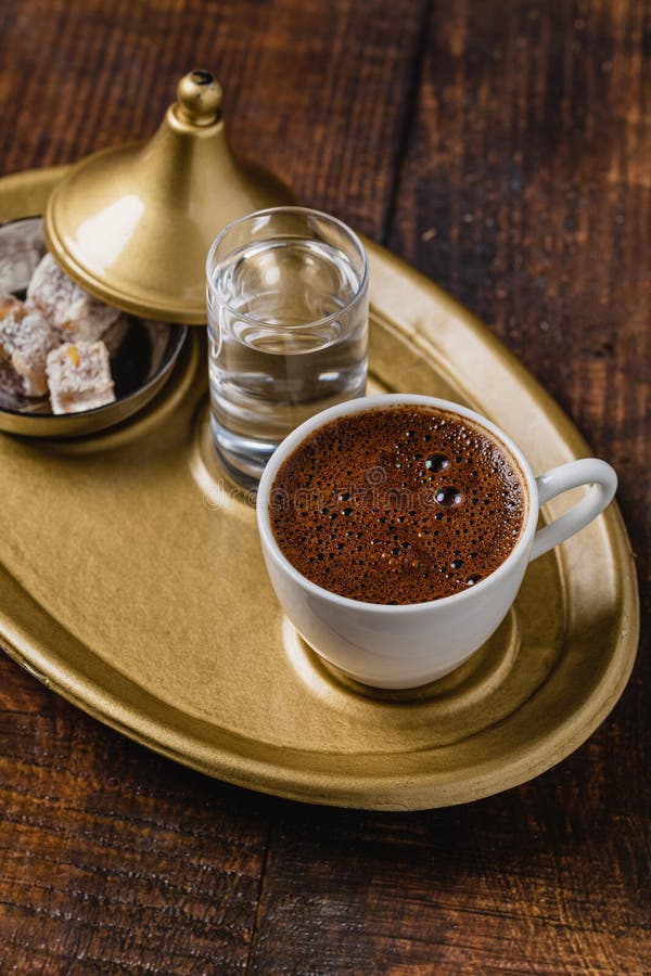 Turkish Coffee in Classic Coffee Cup with Water and Turkish Delight on ...