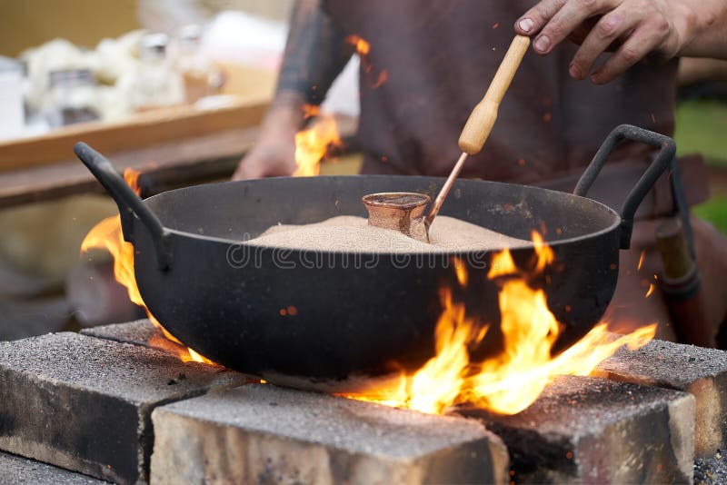 Turkish Coffee Made on Fire. Man Cooking Turkish Coffee Stock Photo ...