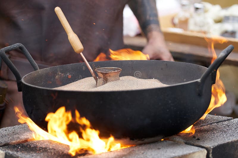 Turkish Coffee Made on Fire. Man Cooking Turkish Coffee Stock Photo ...