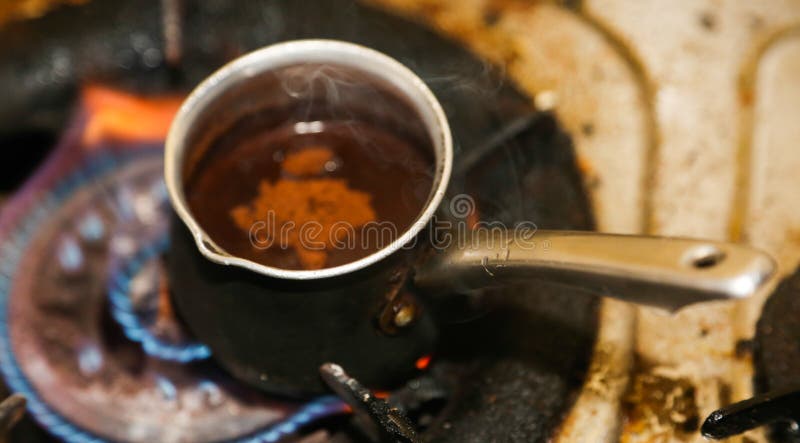 Tea And Coffee On The Fire. A Pot And A Turk On A Fire Outdoors. Stock ...