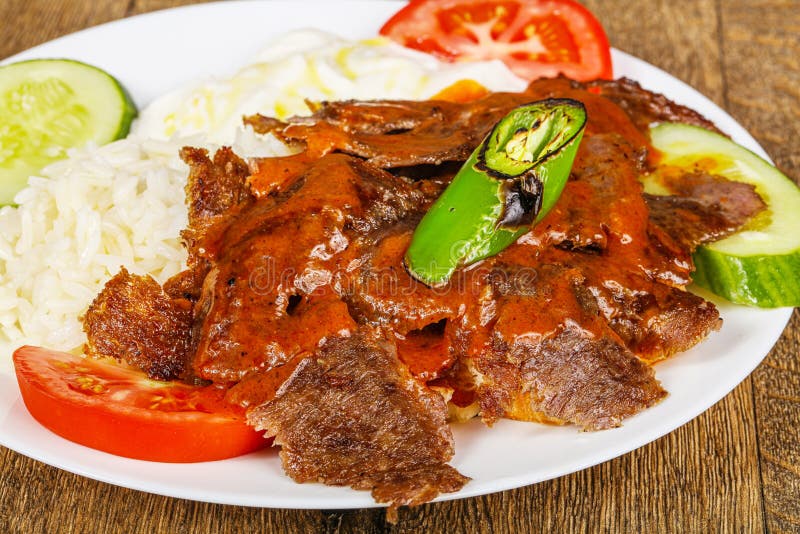 Iskander Kebab is a Turkish Dish with Meat, Spices and Vegetables on a ...