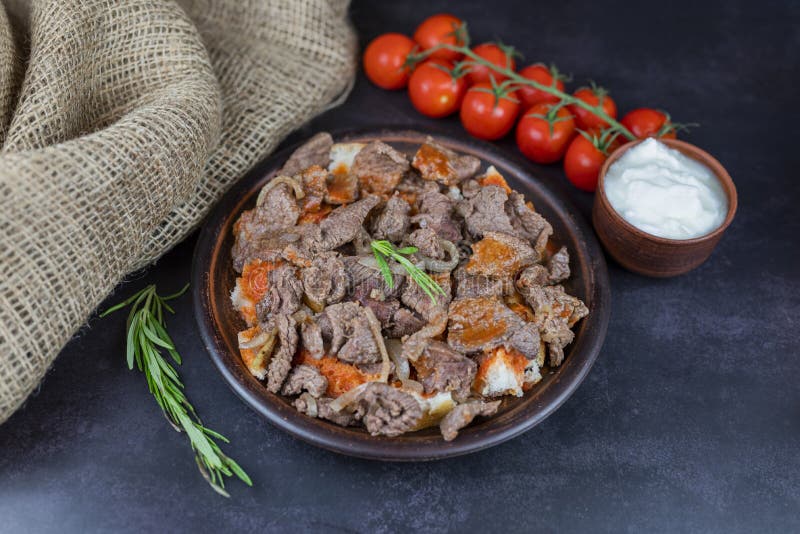 Iskander Kebab is a Turkish Dish with Meat, Spices and Vegetables on a ...