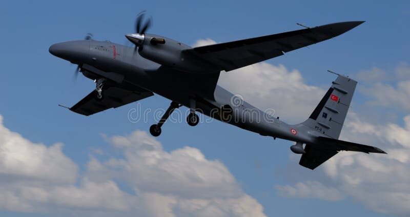 Turkish Drone in Flight. Dramatic Silhouette Against Blue Sky and ...