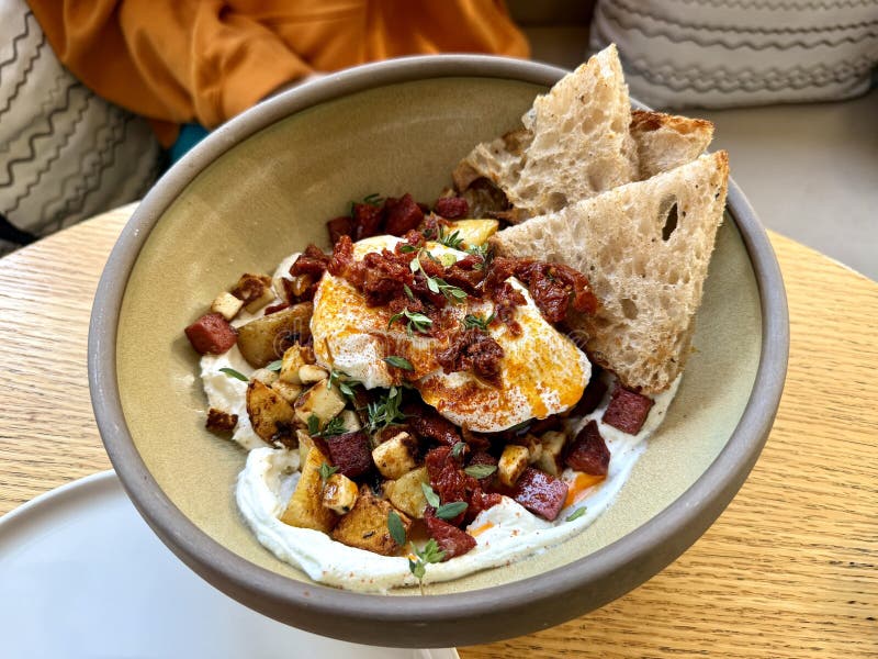 Turkish Eggs Cilbir in a White Bowl. Turkish Cuisine Concept Stock ...