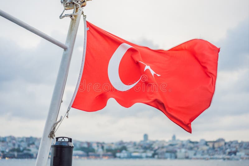 Turkish Flag Flying in the Wind Against the Background of the Sea and ...