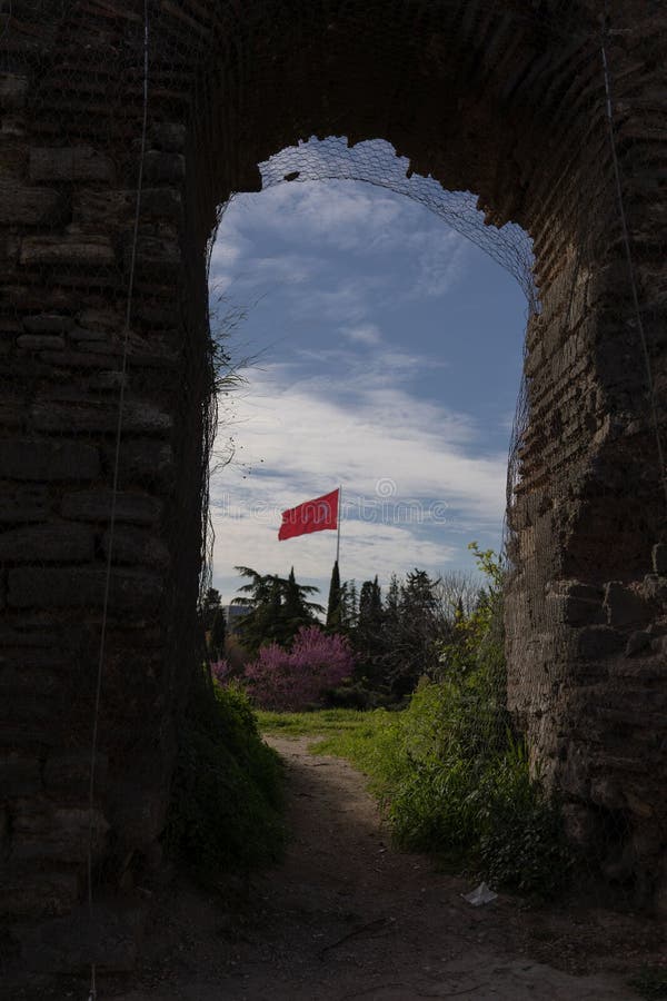Turkish Flag Framed by Ancient Stone Arch with Spring Blossoms Stock ...