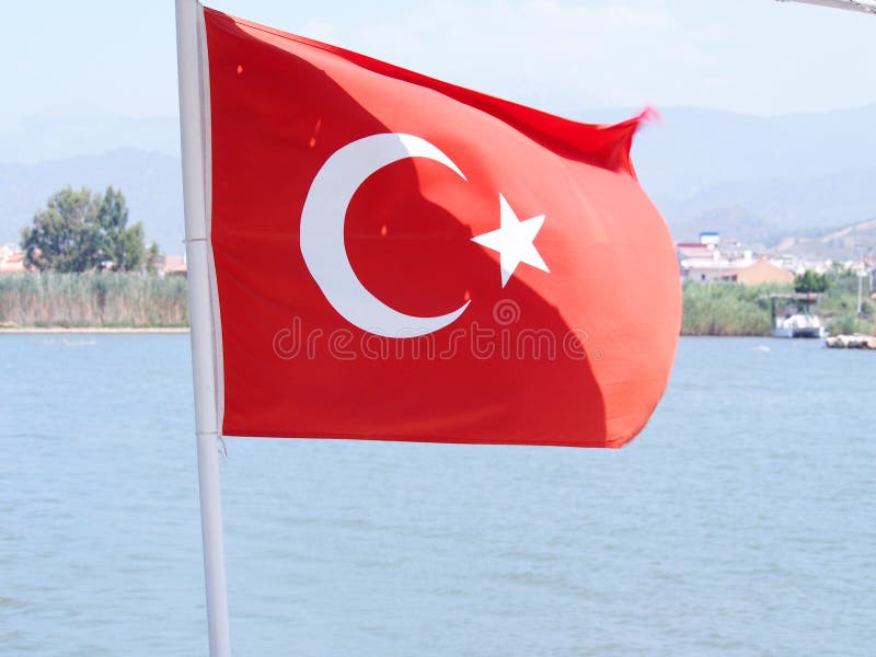 Red flag with amblem stock photo. Image of emblem, pole - 11180376