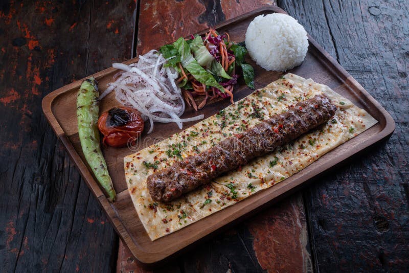 Turkish Lula Lamb or Beef Kebab with Rice and Vegetables on Rustic ...