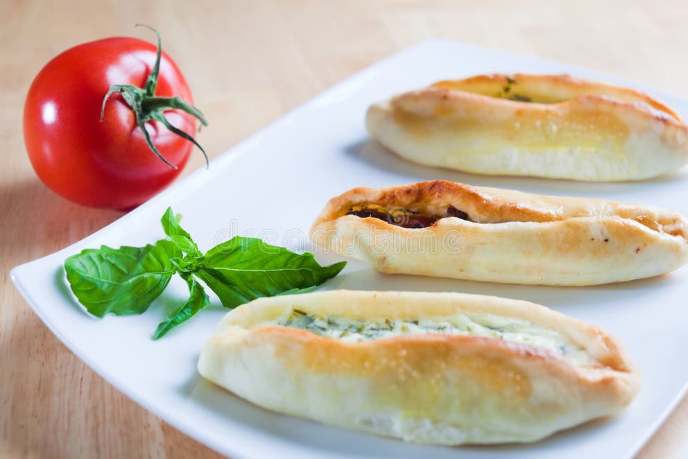 Turkish Pide with Basil Leaves and Tomato Stock Photo - Image of ...