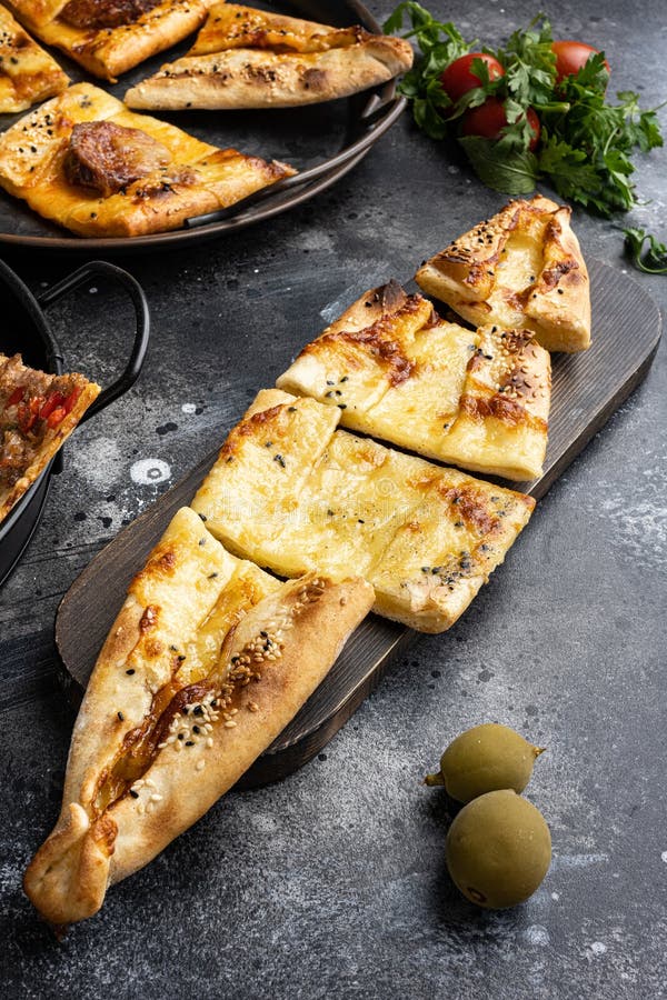 Turkish Pide with Cheese, on Black Dark Stone Table Background Stock ...