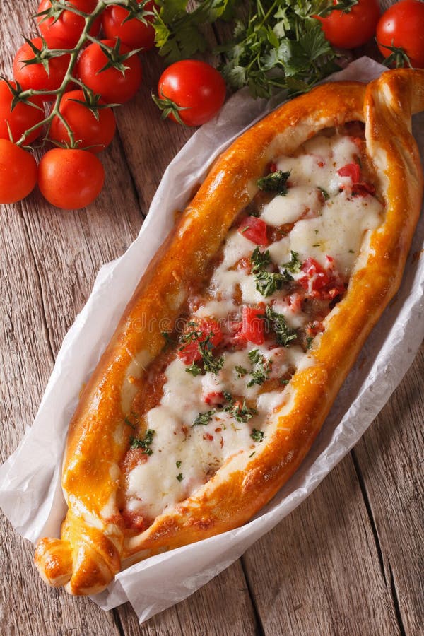 Turkish Pide Close Up on the Table and Ingredients. Vertical Top Stock ...