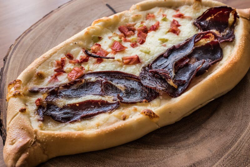 Turkish Pide With Cheese And Cubed Meat / Kusbasili Kasarli Pide. Stock ...