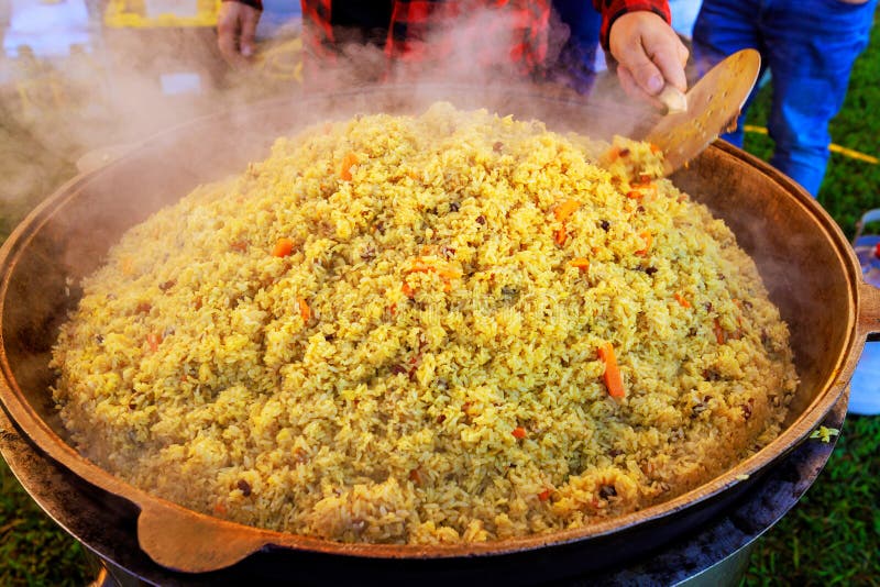 Turkish Pilaf is Cooked in a Large Cast Iron Cauldron during Cooking ...