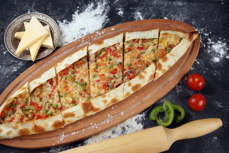 Turkish Pizza is Called Pide. Dish with Pide with Cheese on a Dark ...