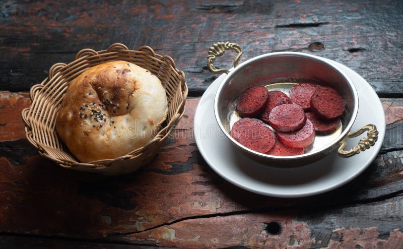 Turkish Sausage Sucuk and Bread Roll on Rustic Wooden Table Stock Photo ...