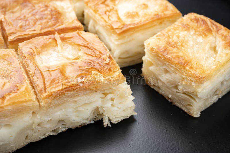 Turkish Su Boregi Burek with Paynir, on Black Dark Stone Table ...
