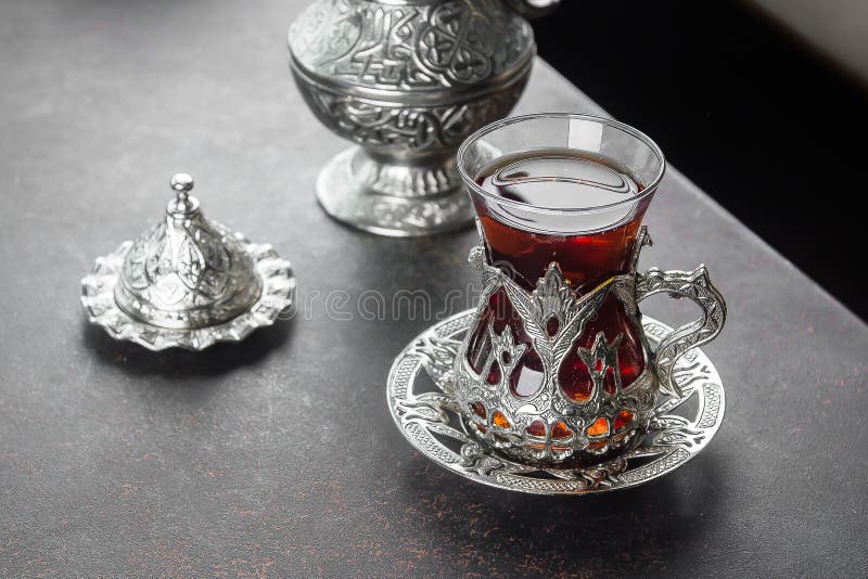 Turkish Tea in Traditional Glass on Dark Table Stock Image - Image of ...