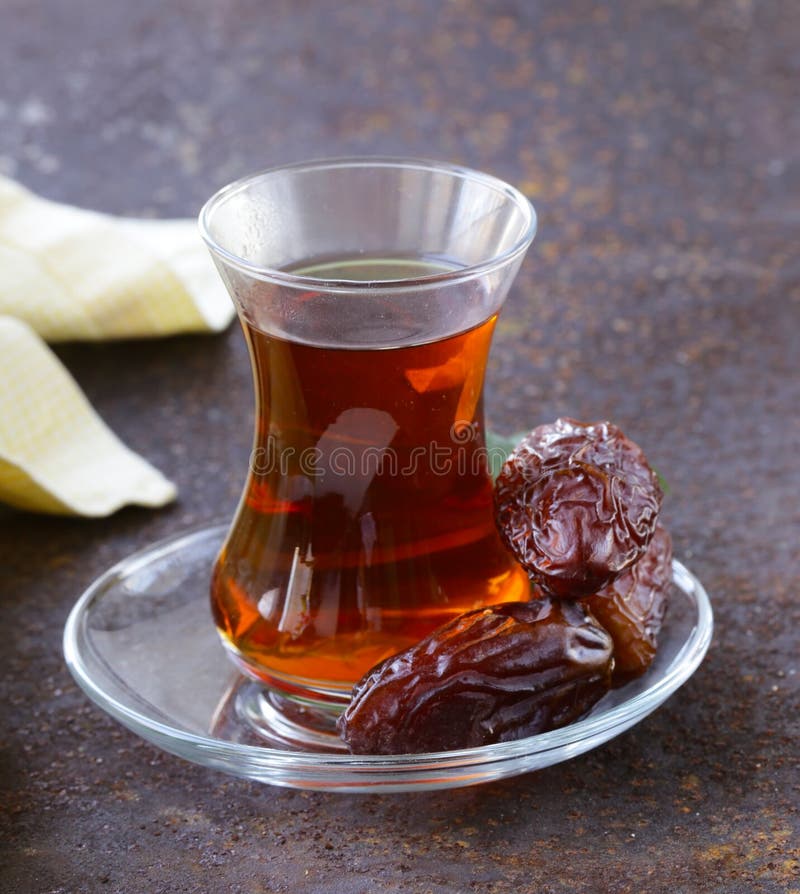 Turkish Tea in Traditional Glass with Dates Stock Photo - Image of ...