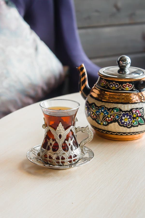 Turkish Tea in Traditional Glass on Table. Drink in National Restaurant ...