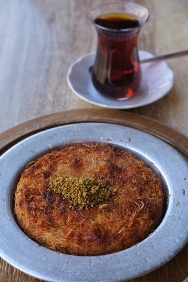 Turkish Traditional Delight Kunefe in Plate and a Glass of Black Tea ...