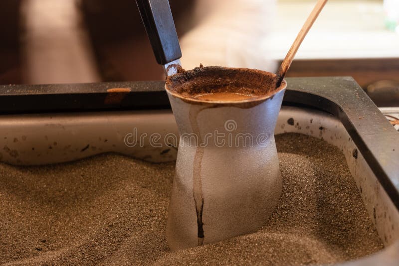 Turks with Coffee on Hot Sand. Preparing Coffee in Jezva in Sand ...