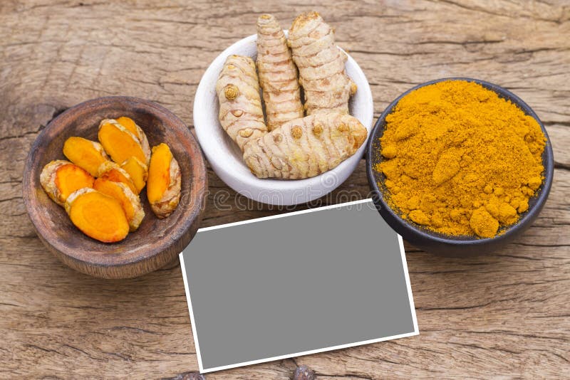 Turmeric in bowl on table stock photo. Image of orange - 120131084