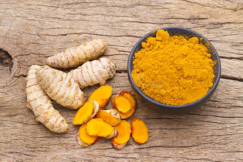 Turmeric in bowl on table stock image. Image of herb - 120131213