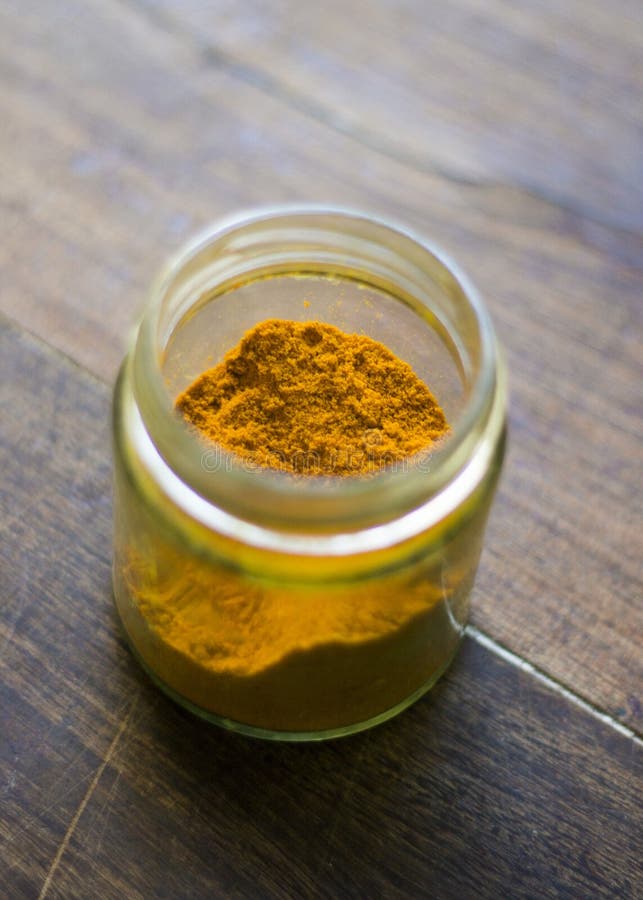 Turmeric Jar Over Wooden Table Stock Image - Image of spoon, curcuma ...