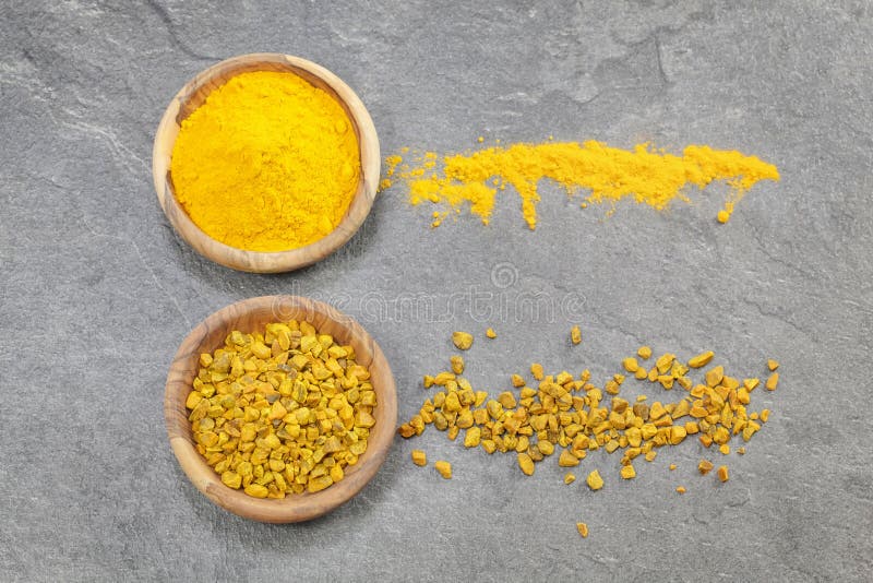 Turmeric pieces and powder stock image. Image of angle - 52495185