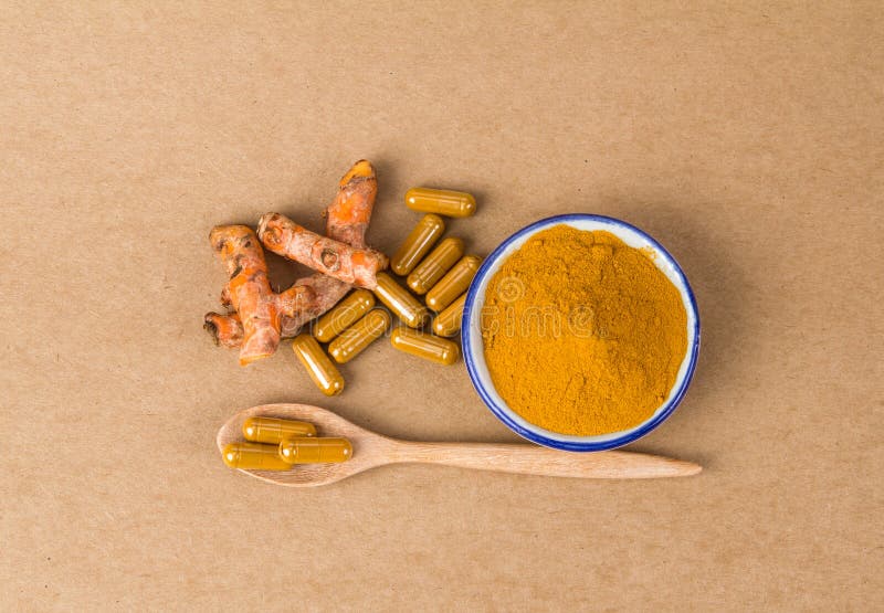 Turmeric Powder and Capsule and Roots Curcumin on Brown Pape Stock ...