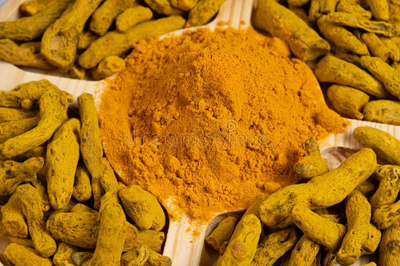 Natural Turmeric Oil in a Glass Bottle with Ground Turmeric Powder and ...