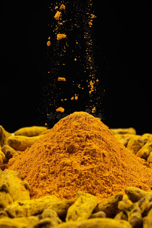 Turmeric Powder Sprinkled on the Dry Turmeric Root Stock Photo - Image ...