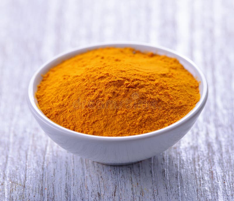 Turmeric Powder in White Bowls on Wooden Table. Herbal Stock Image ...