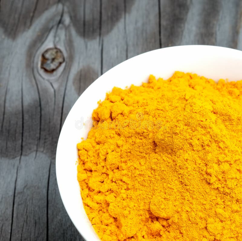 Turmeric Powder in White Cup on Wooden. Stock Photo - Image of organic ...