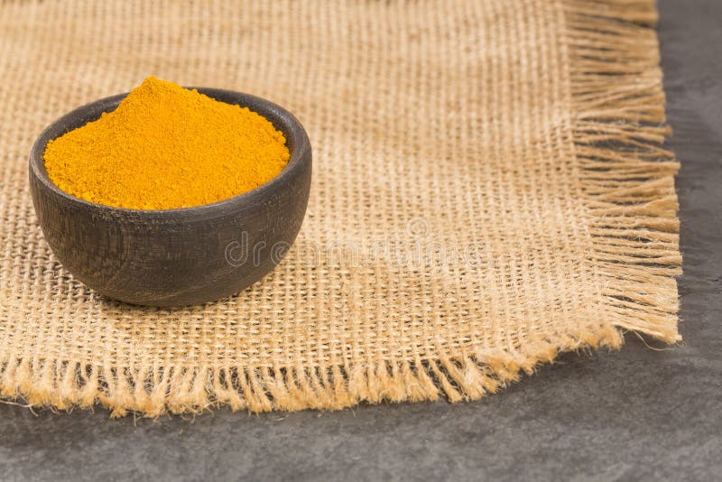 Turmeric Powder in the Wooden Bowl Stock Photo - Image of food, cooking ...