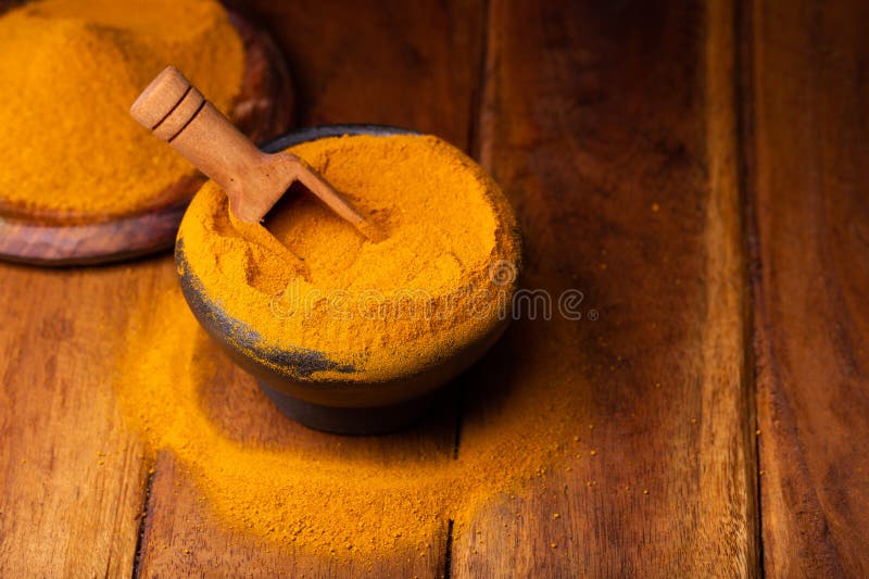 Turmeric Powder in a Wooden Spoon and Bowl Stock Image - Image of ...