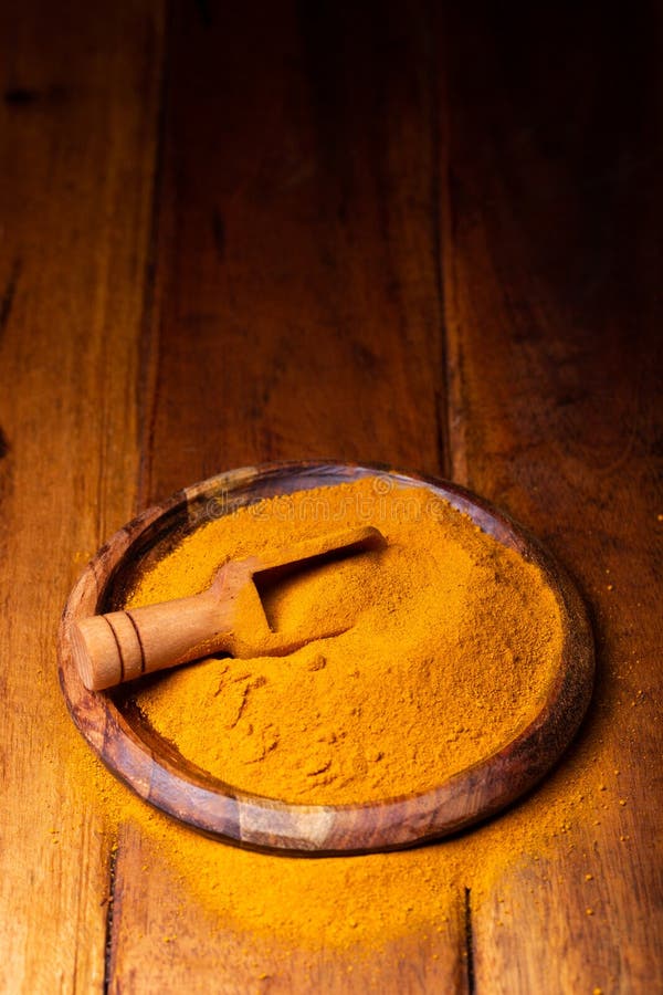 Turmeric Powder in a Wooden Spoon and Bowl Stock Photo - Image of bowl ...
