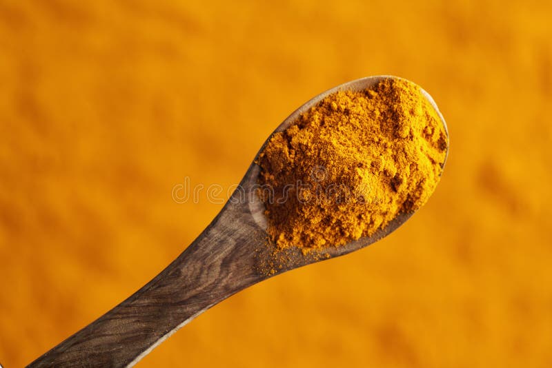 Turmeric Powder on a Wooden Spoon, Top View Stock Photo - Image of ...