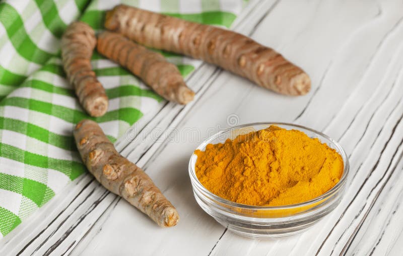 Turmeric Root and Ground Turmeric in a Bowl Stock Photo - Image of ...