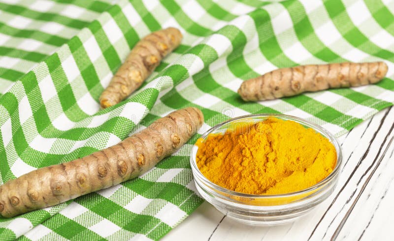 Turmeric Root and Ground Turmeric in a Bowl Stock Image - Image of bowl ...