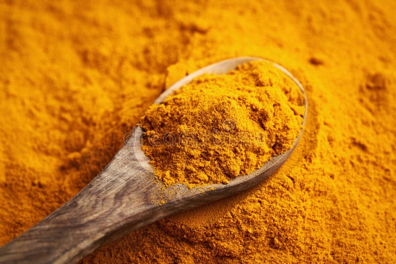 Turmeric Root Powder on a Spoon, Closeup Stock Photo - Image of ...