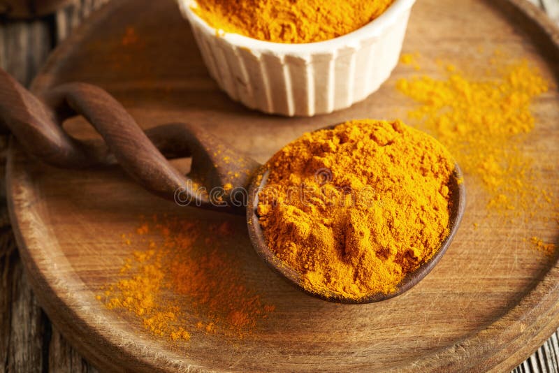 Turmeric Root Powder on a Wooden Spoon Stock Photo - Image of condiment ...
