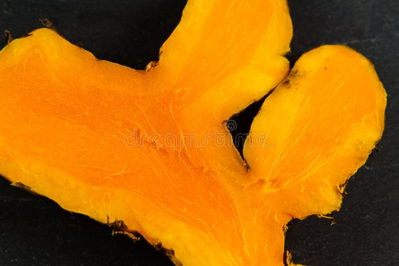 Turmeric Root Sliced Open on Dark Slate Background Stock Photo - Image ... Turmeric Root Sliced Open on Dark Slate Background Stock Photo - Image ...