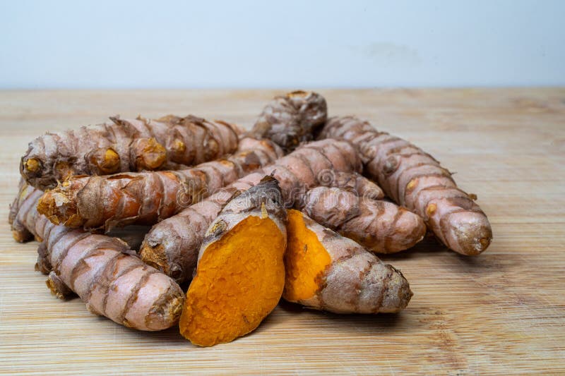 Turmeric Root on a Wooden Cutting Board. Stock Image - Image of slice ...