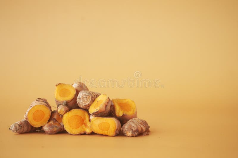 Turmeric Roots on a Orange Color Background with Copy Space Stock Image ...