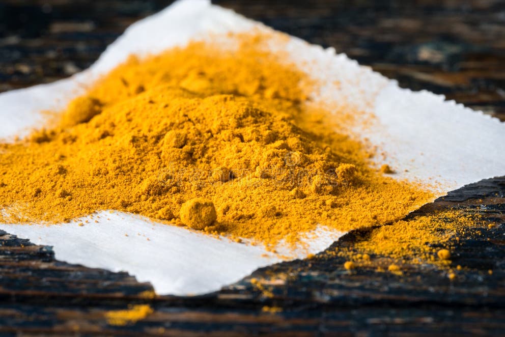 Ground Turmeric Root on Parchment Stock Photo - Image of flavor ...