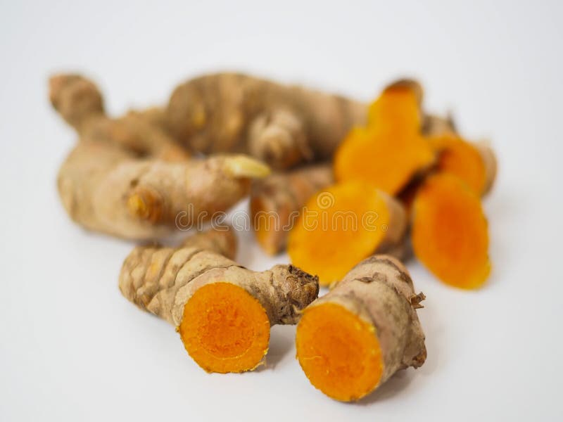 Diagonal Turmeric Slice Composition with Rich Orange Core on Clean ...